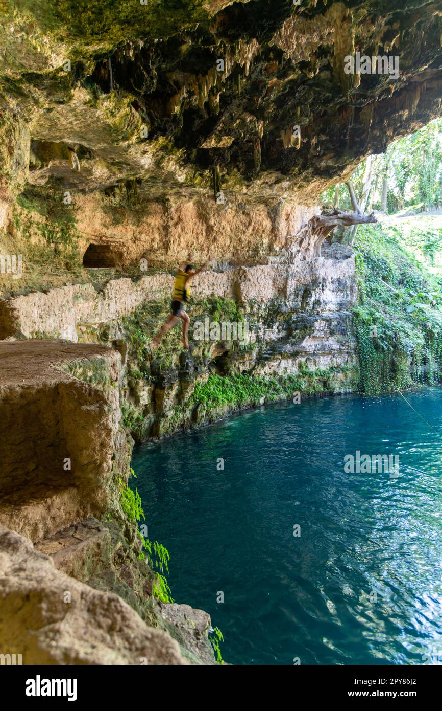 Man jumping water hole hi-res stock photography and images - Alamy
