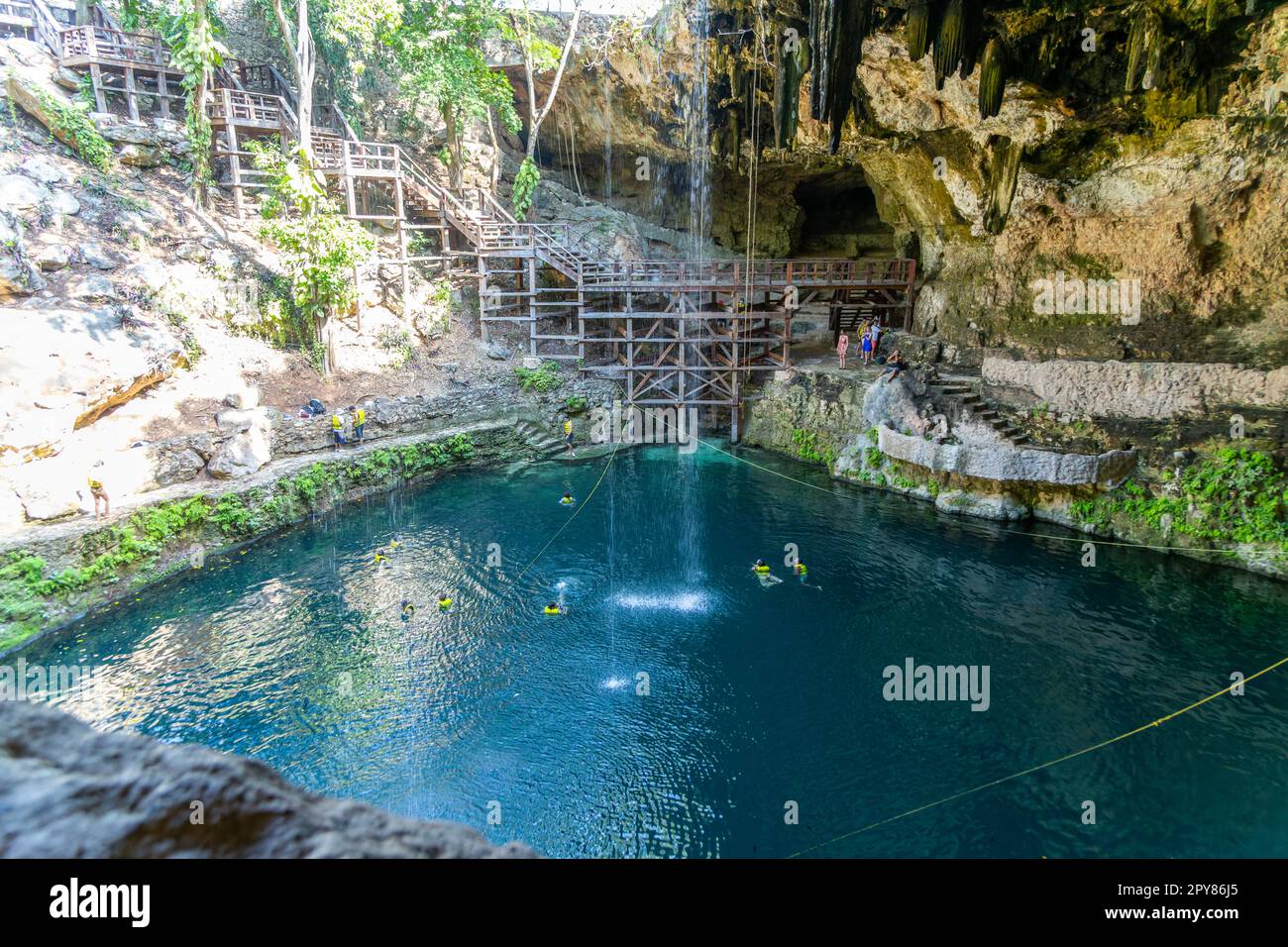 People swimming in Cenote Zaci carboniferous limestone swallow hole ...
