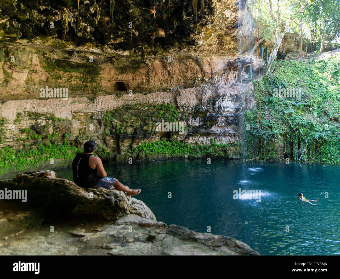 People swimming in Cenote Zaci carboniferous limestone swallow hole ...