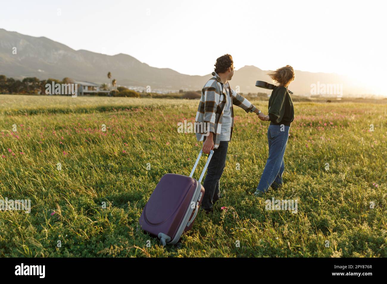 Inspired young loving couple is looking at living plan in future. They ...