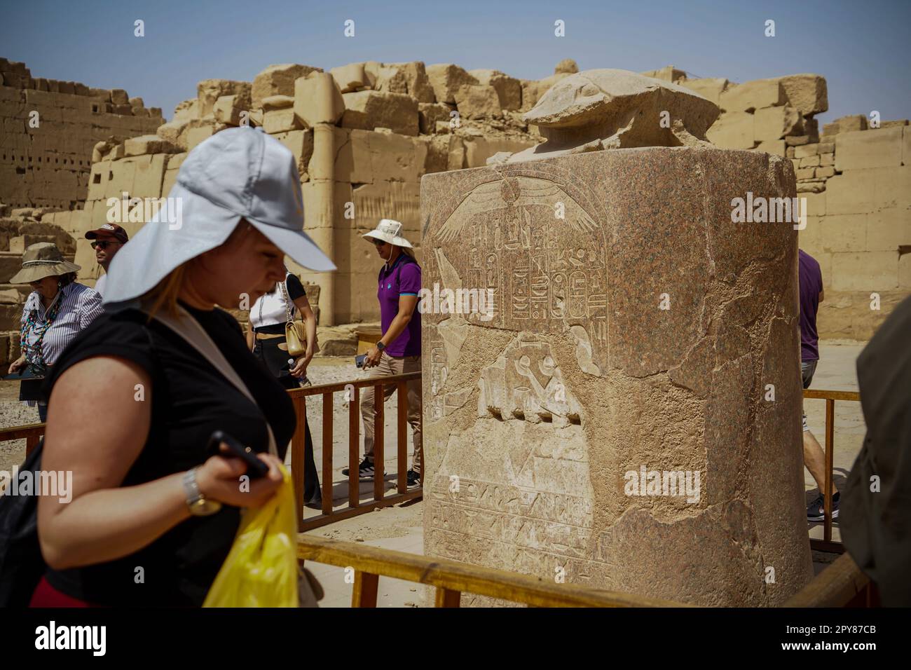Luxor, Egypt. 20th Apr, 2023. Tourists seen encircling a scarab statue ...