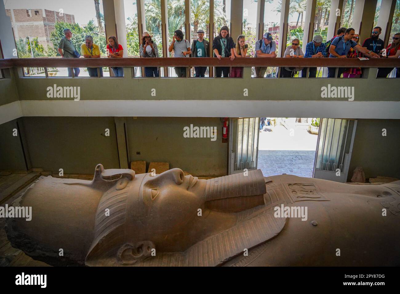 Giza, Egypt. 15th Apr, 2023. Tourists overlook a fallen limestone ...