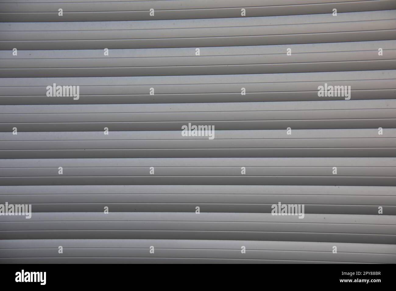 Industrial door with steel slats Stock Photo - Alamy