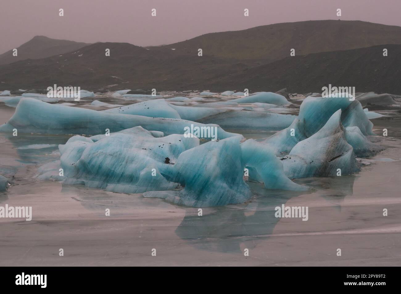 Irregular ice pieces in valley landscape photo Stock Photo - Alamy