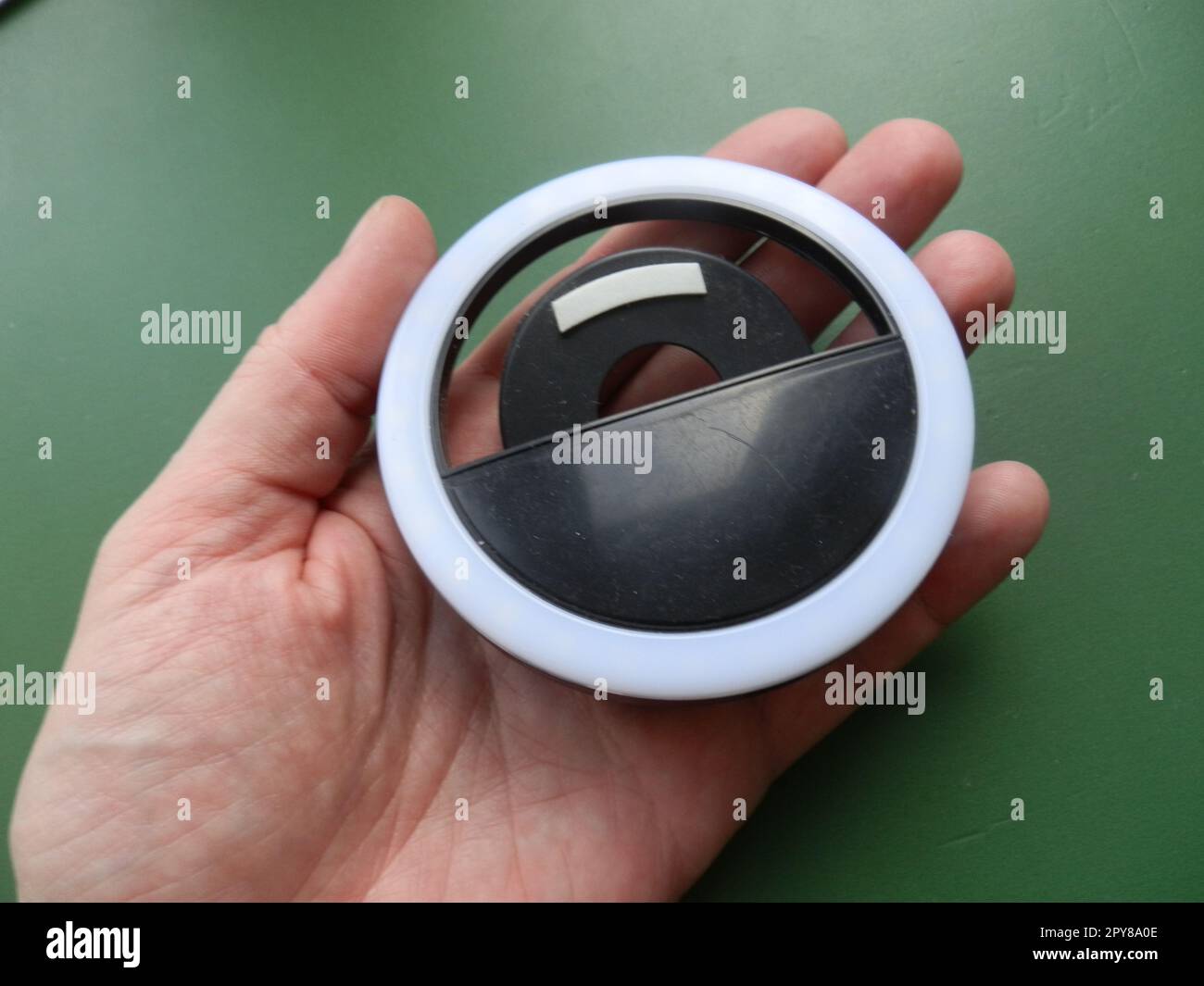Accessory for smartphone and computer in hand Stock Photo - Alamy