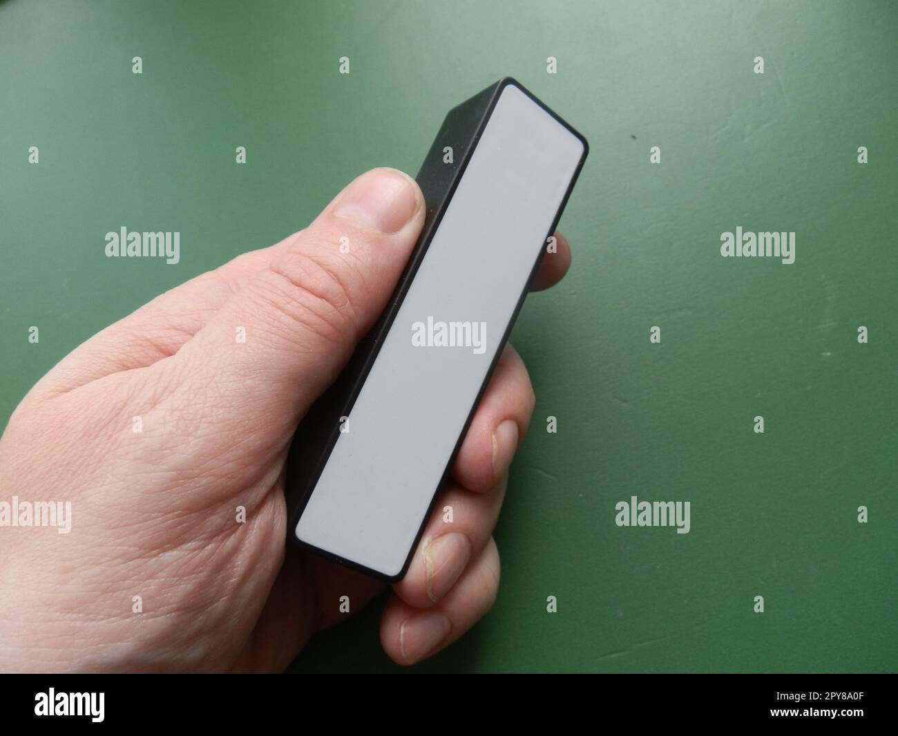 Accessory for smartphone and computer in hand Stock Photo - Alamy