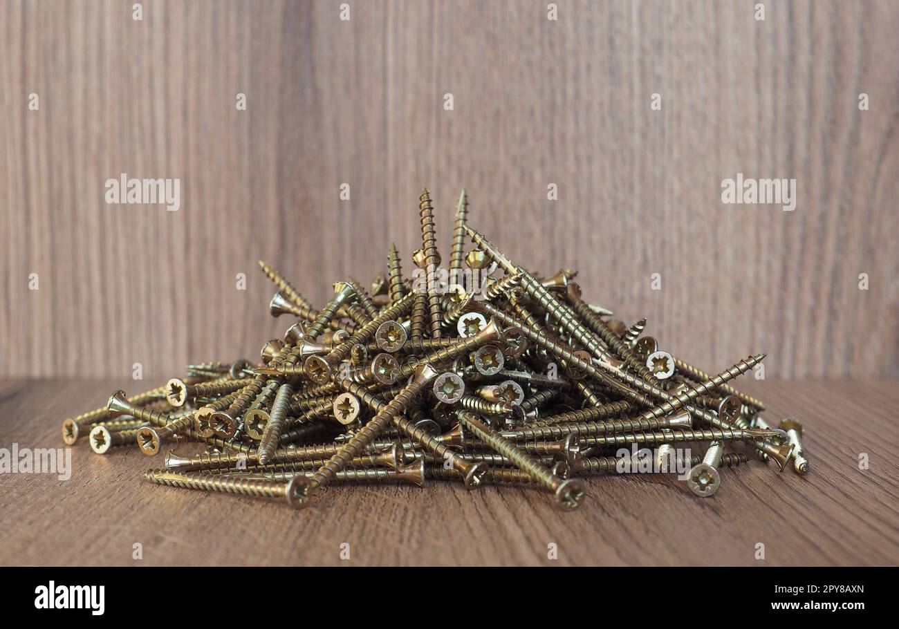 wood screws on manufactured wood panel Stock Photo - Alamy