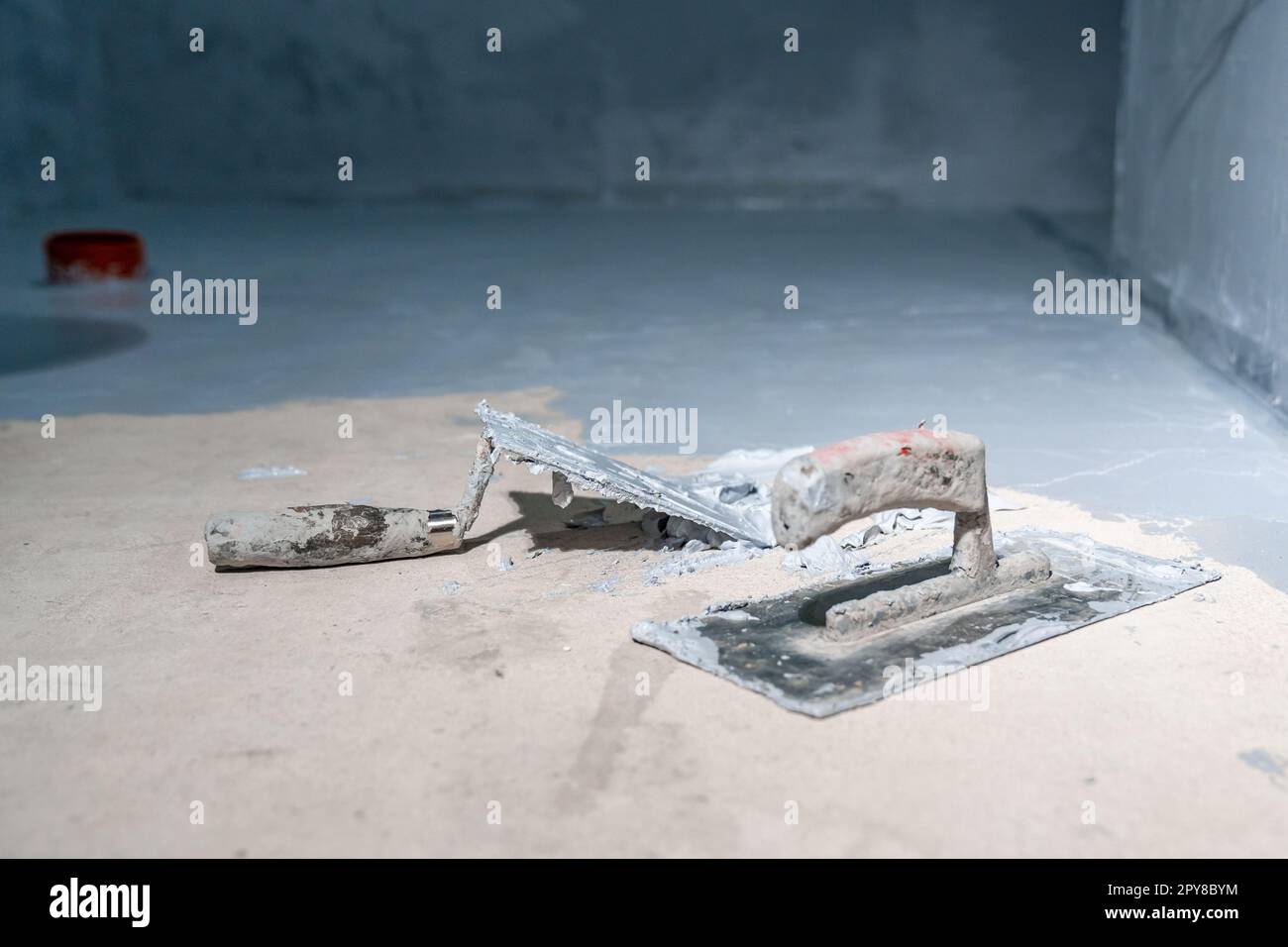 masonry work with a trowel on the construction site Stock Photo - Alamy