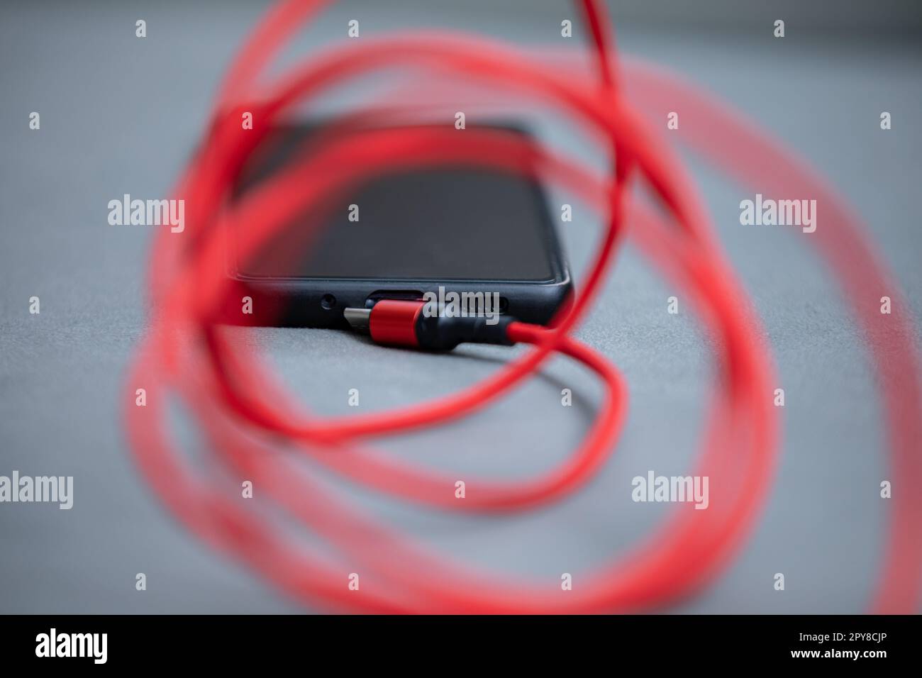 A view of a lying cell phone that is not wired to a charger Stock Photo ...