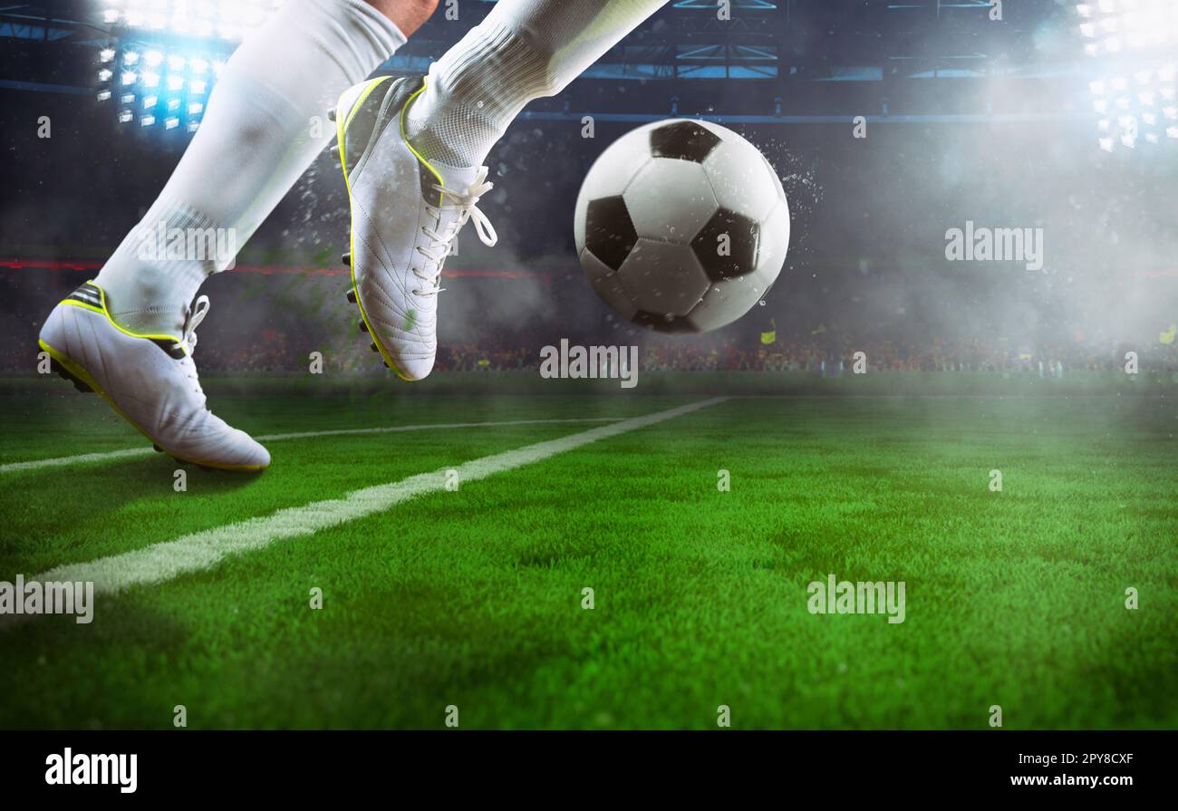 Football scene at night match with close up of a soccer player running ...