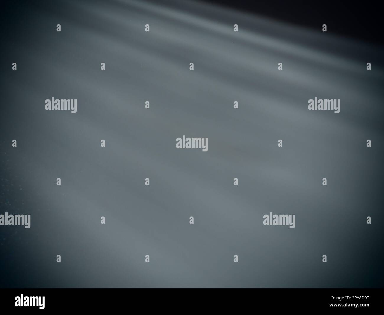 Diagonal Rays Of Light On A Gray Background Blurred Abstract