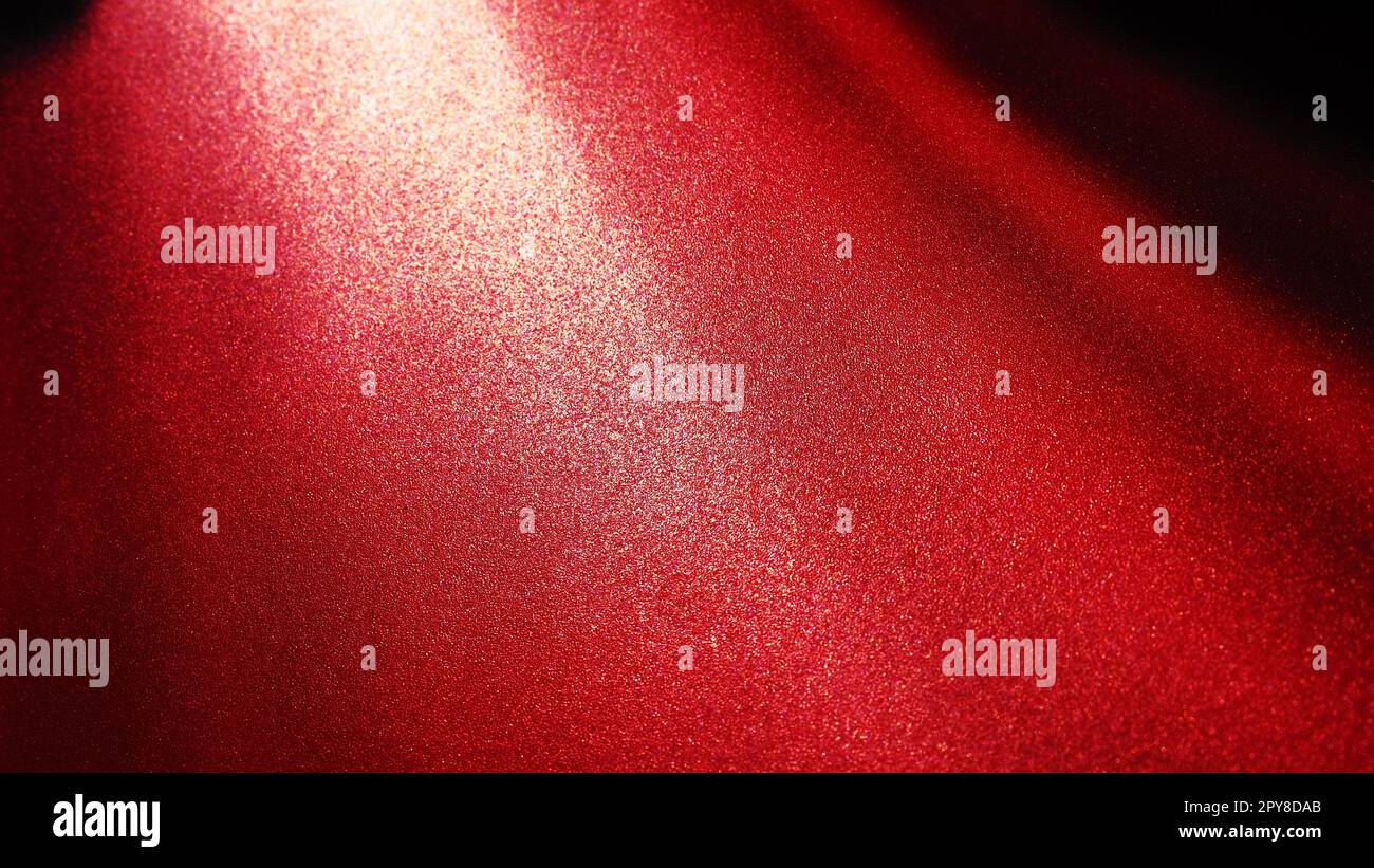 Diagonal rays of light on a red or scarlet background. Blurred abstract ...