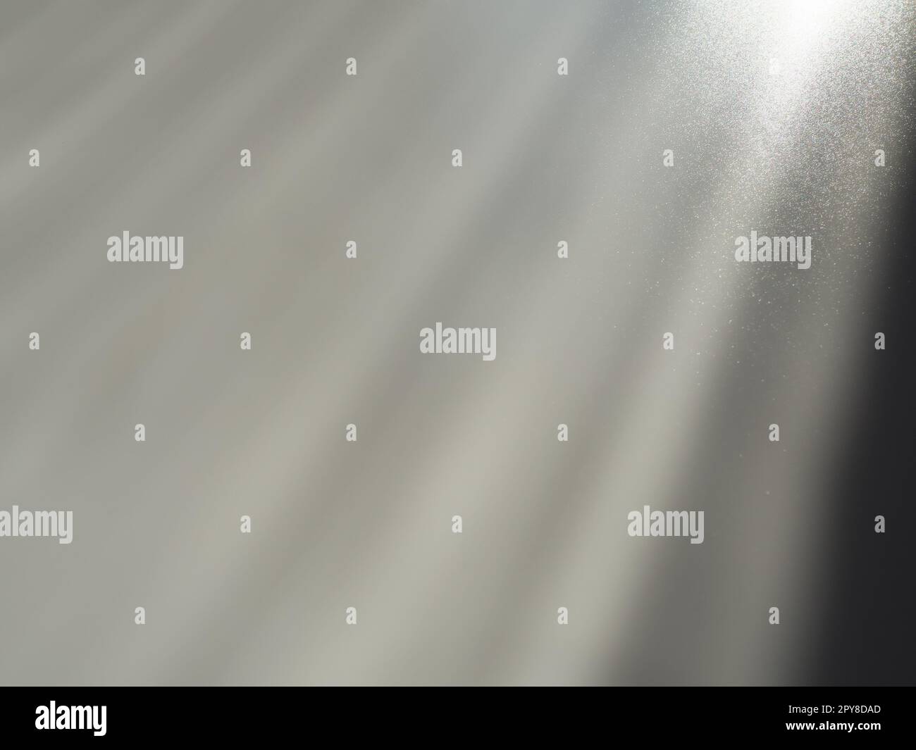 Diagonal rays of light on a gray background. Blurred abstract ...