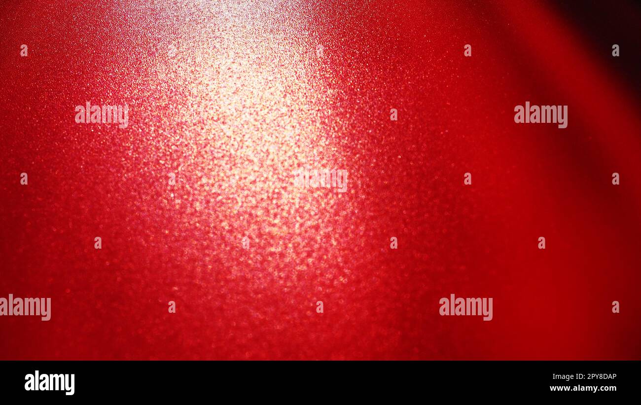 Diagonal rays of light on a red or scarlet background. Blurred abstract ...