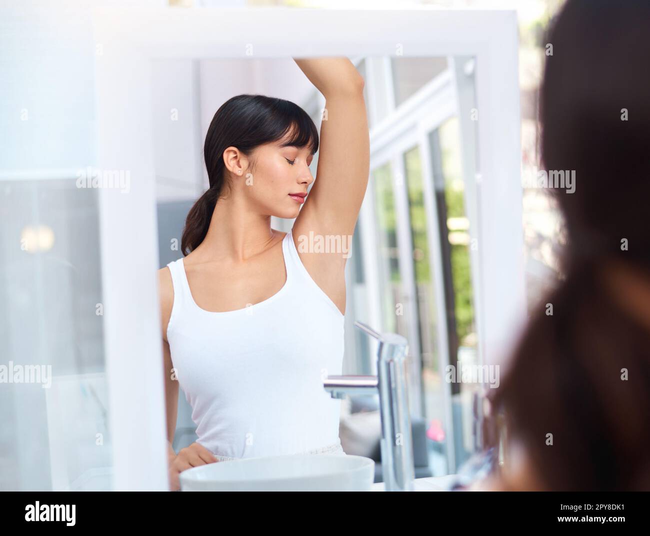 Thats a close shave. a cheerful attractive young woman standing next to ...