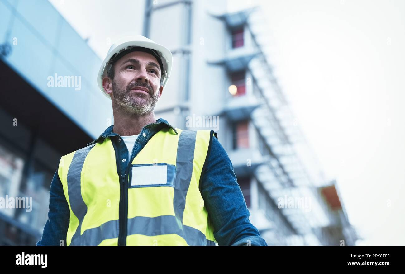 Its time to implement that vision. a engineer standing in front of a ...