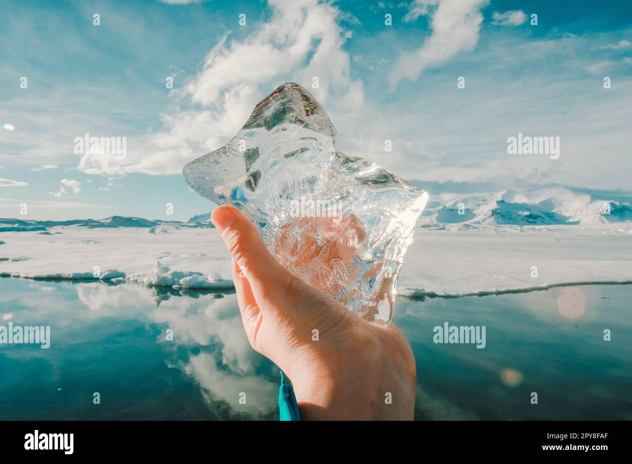 Close up man showing ice at glacier concept photo Stock Photo - Alamy