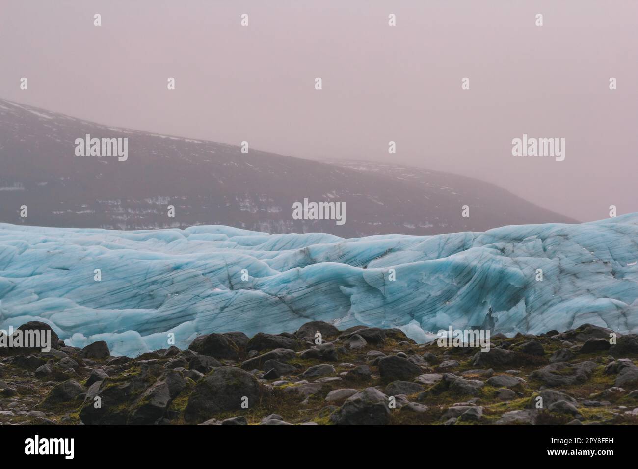 Ice mountain in rocky valley landscape photo Stock Photo - Alamy