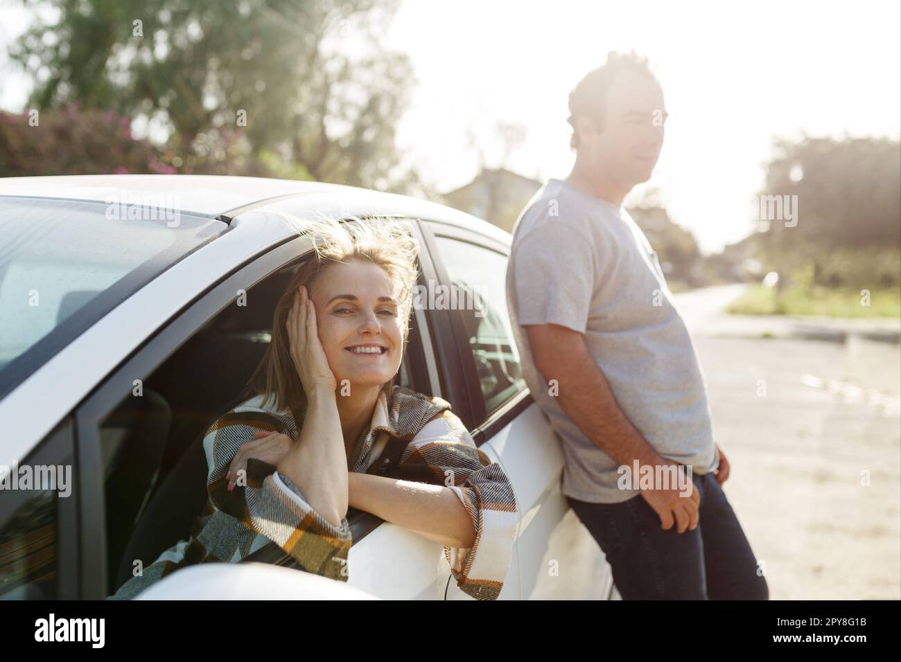 Young happy lovers having fun on the road. Couple making a wanderlust ...