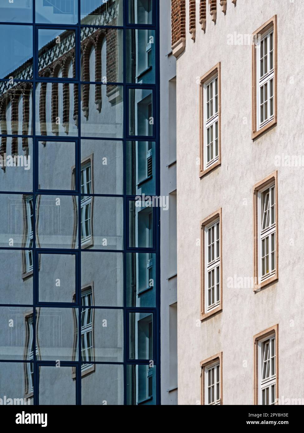 Contrast of old and modern architecture with reflection Stock Photo - Alamy