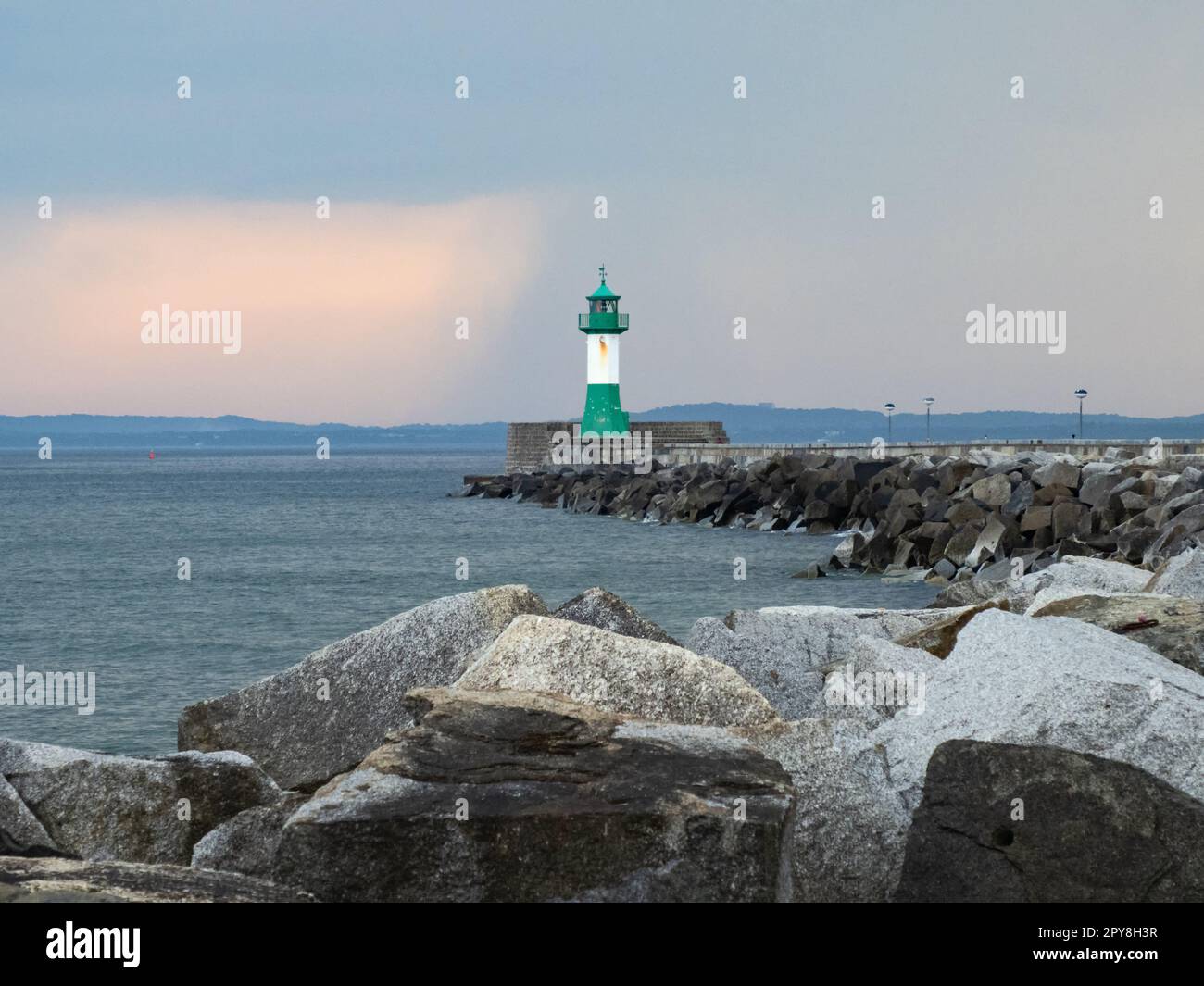 The pier in the town harbor of Sassnitz on the island of Rügen with the ...