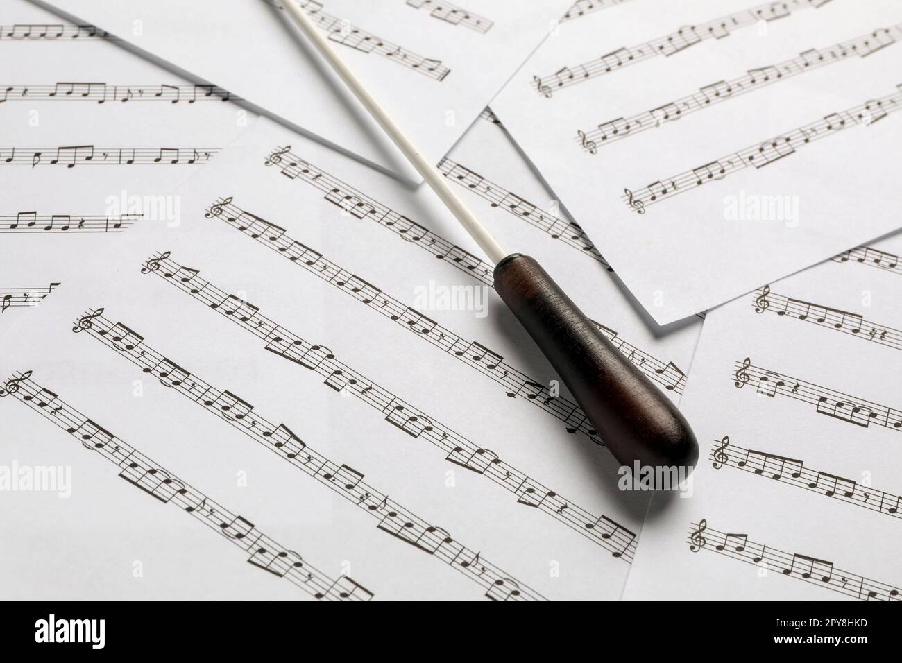 Conductor's baton on sheet music, closeup view Stock Photo - Alamy