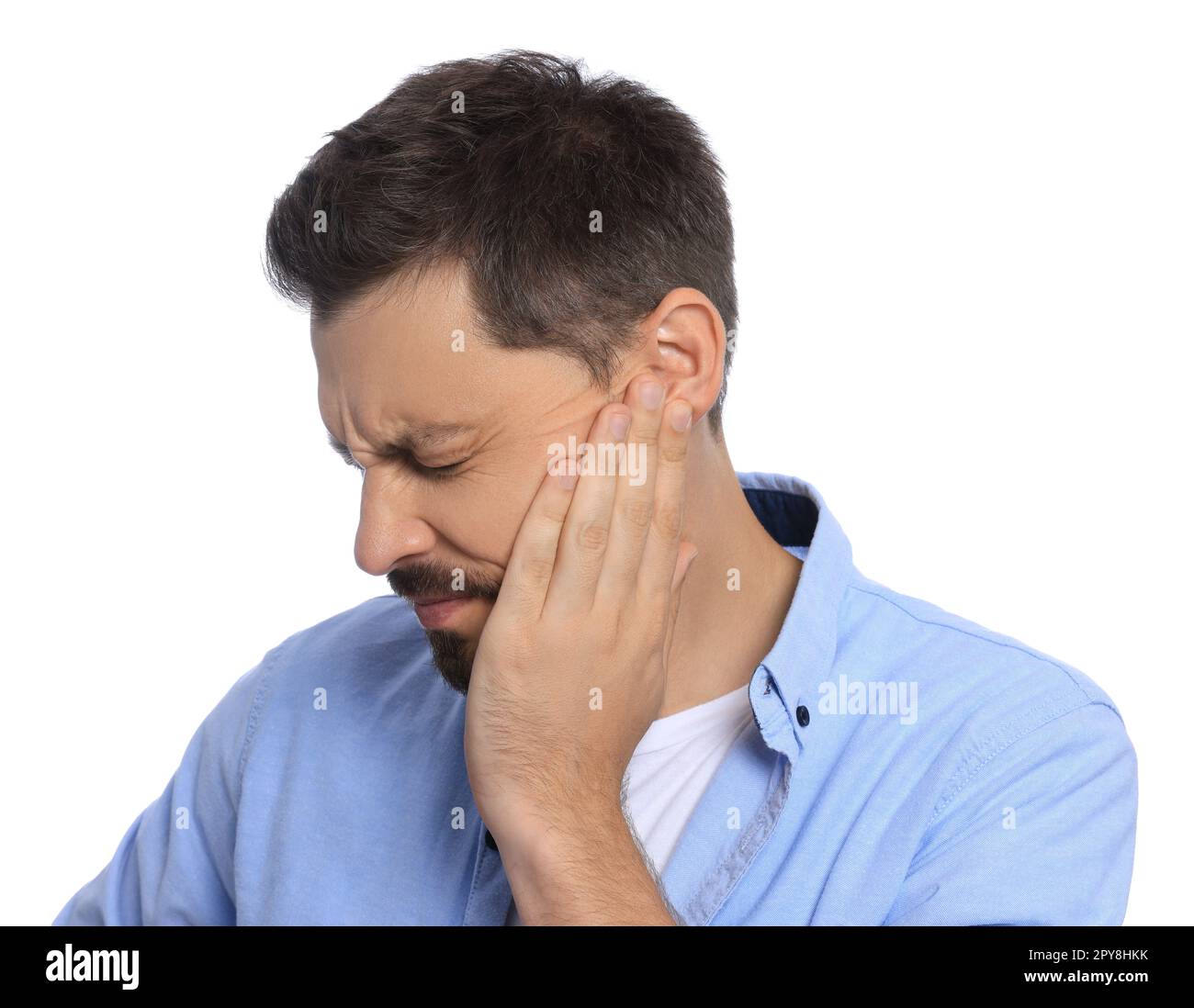 Man suffering from ear pain on white background Stock Photo - Alamy