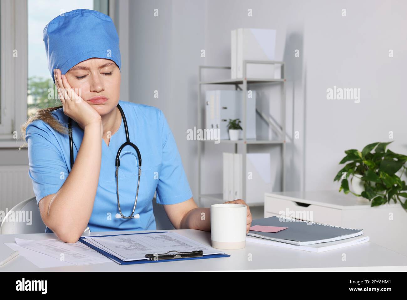 Exhausted doctor sleeping workplace hi-res stock photography and images ...