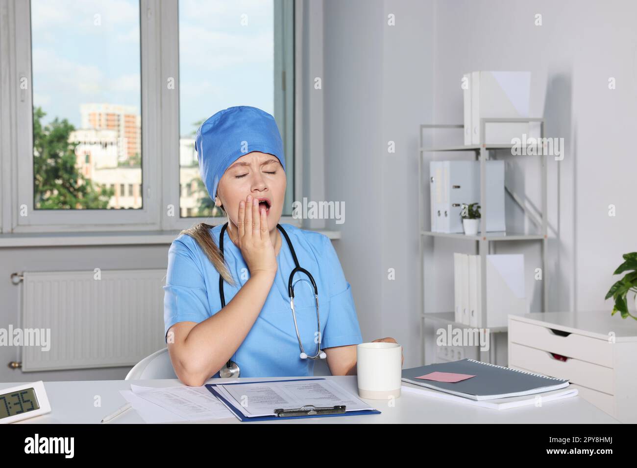 Doctor yawning hi-res stock photography and images - Alamy