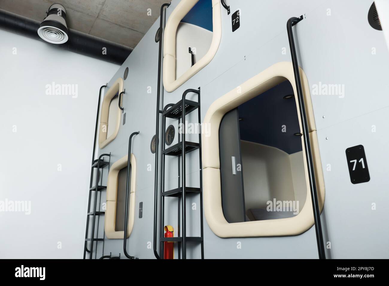 Capsules in modern pod hostel. Stylish interior Stock Photo - Alamy