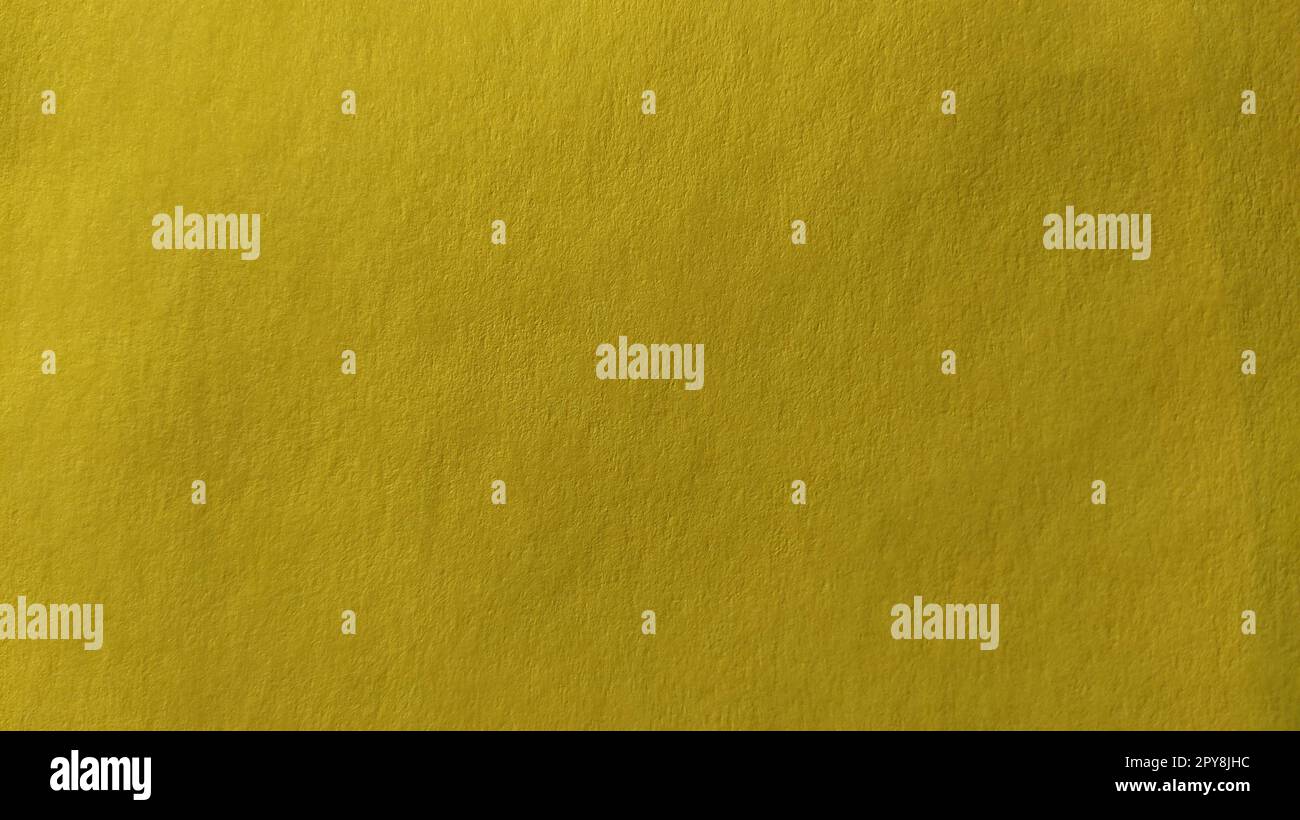 The paper or fabric material is bright yellow. Close-up. Slightly ...