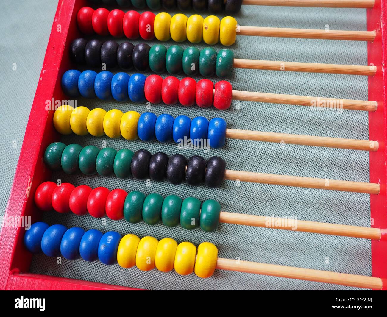 Education concept - abacus with many colorful beads. Red, blue, green ...