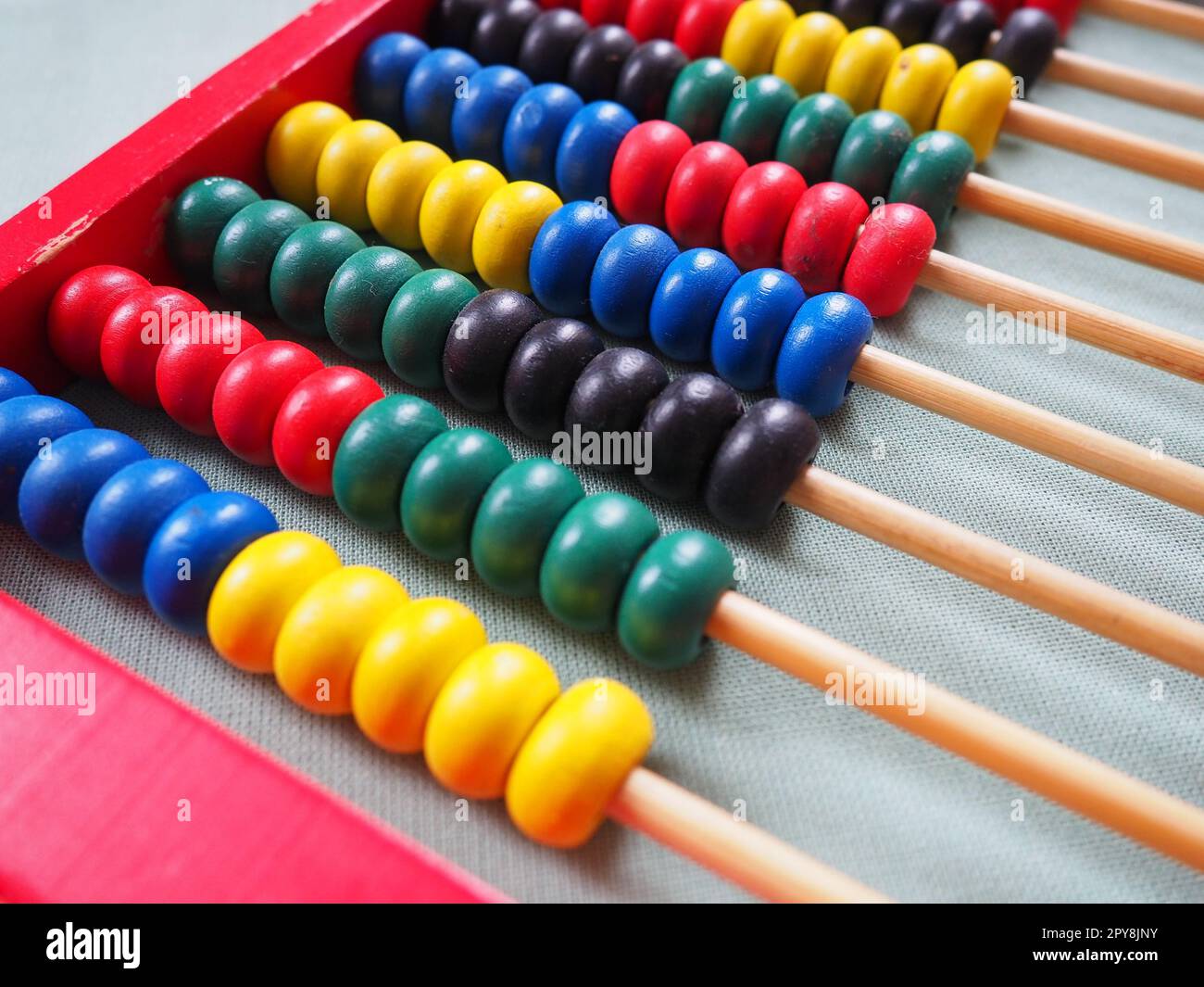 Education concept - abacus with many colorful beads. Red, blue, green ...