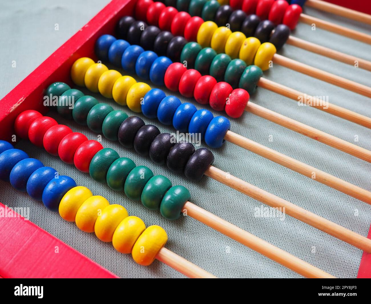 Education concept - abacus with many colorful beads. Red, blue, green ...
