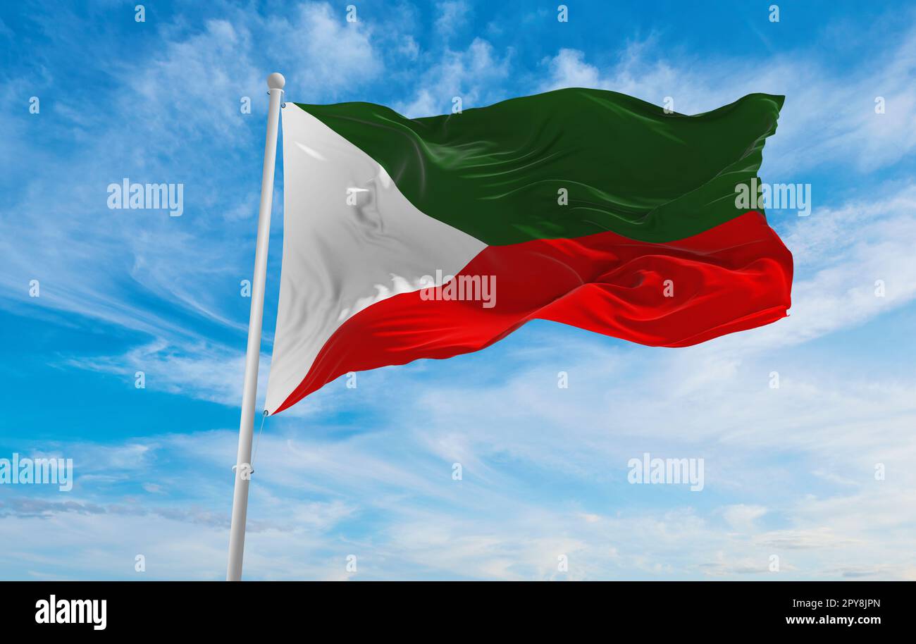 flag of Dardic peoples Kashmiris at cloudy sky background, panoramic ...