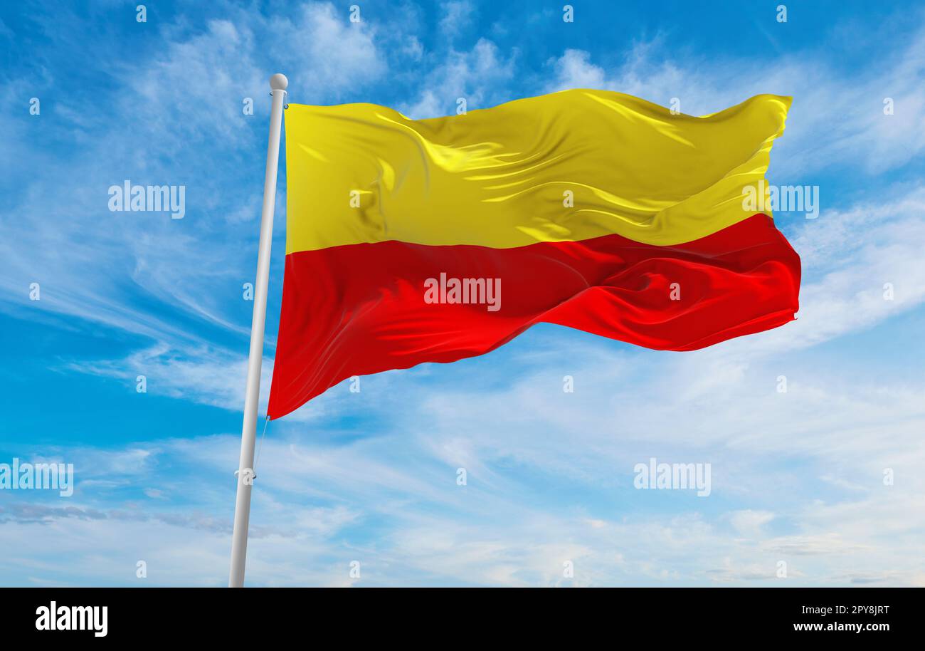 flag of Dravidian peoples Kannadigas at cloudy sky background ...