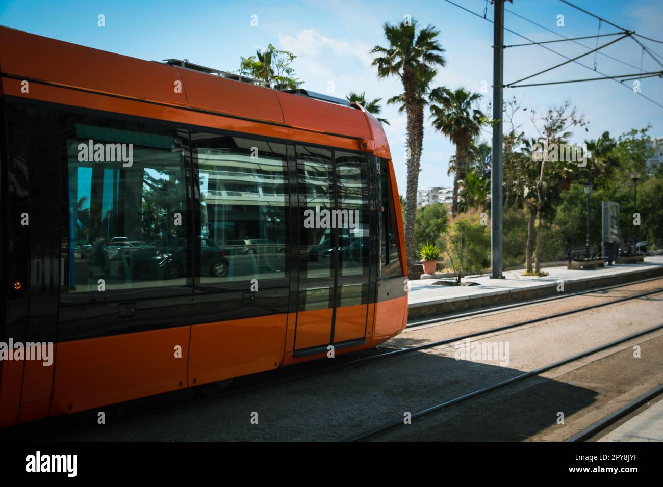 Modern tram on city street. Public transport Stock Photo - Alamy