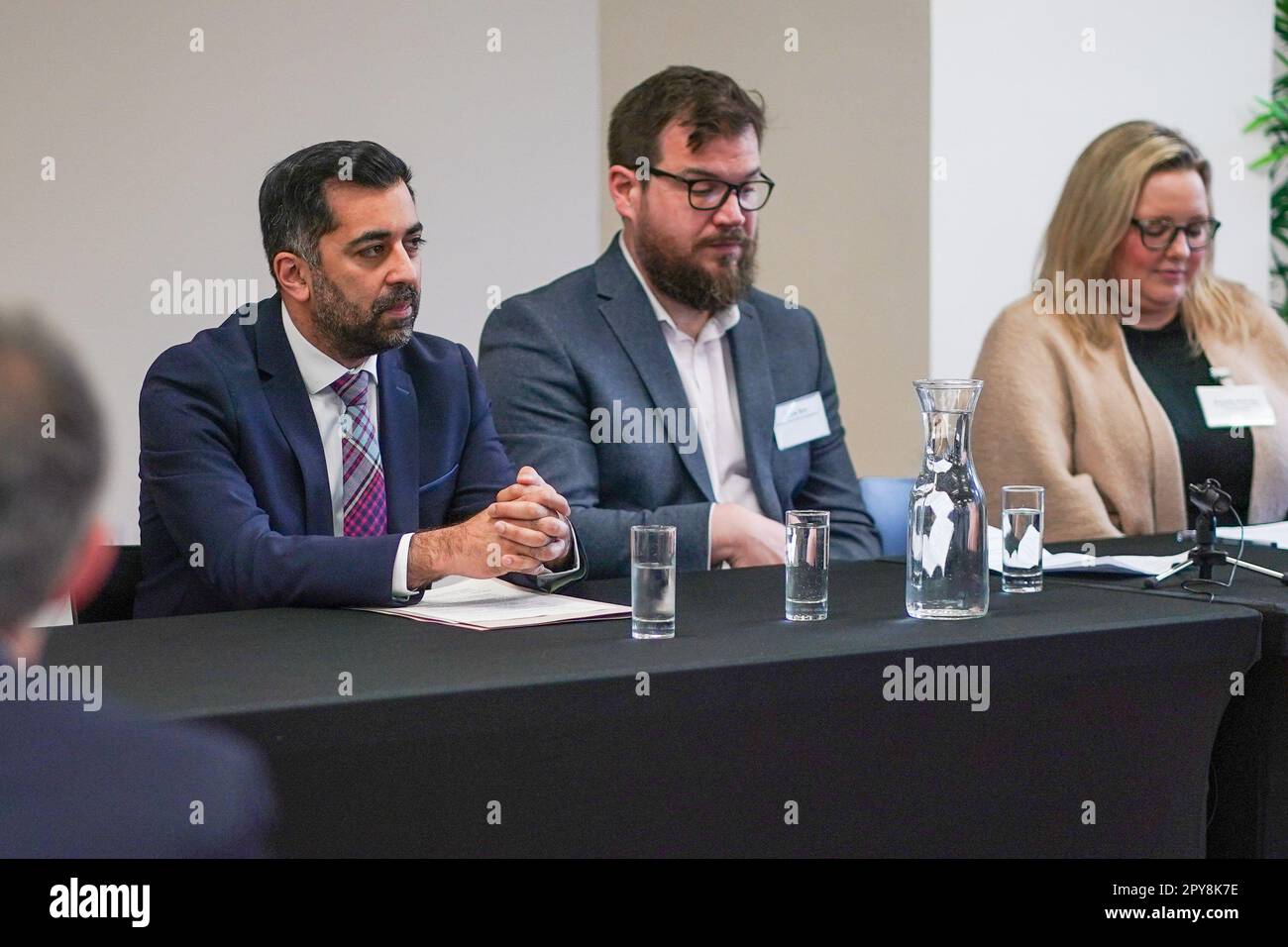 First Minister Humza Yousaf (left) during an anti-poverty summit at Dovecot Studios, Edinburgh ...