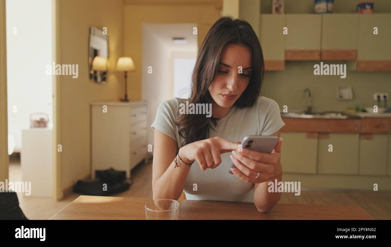 Close-up of girl's hands scrolling through photos and videos on her smartphone Stock Photo - Alamy