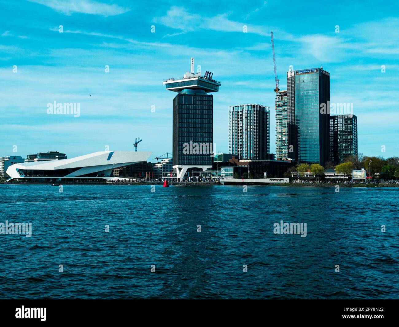 Amsterdam waterfront cityscape by the IJ with the A'DAM Lookout tower ...
