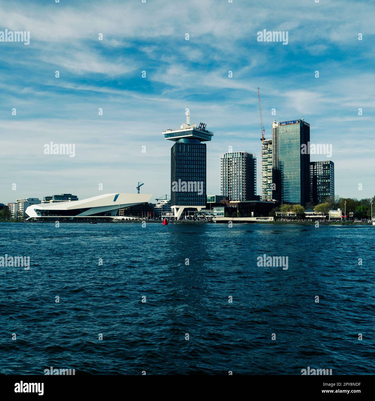 Amsterdam waterfront cityscape by the IJ with the A'DAM Lookout tower ...