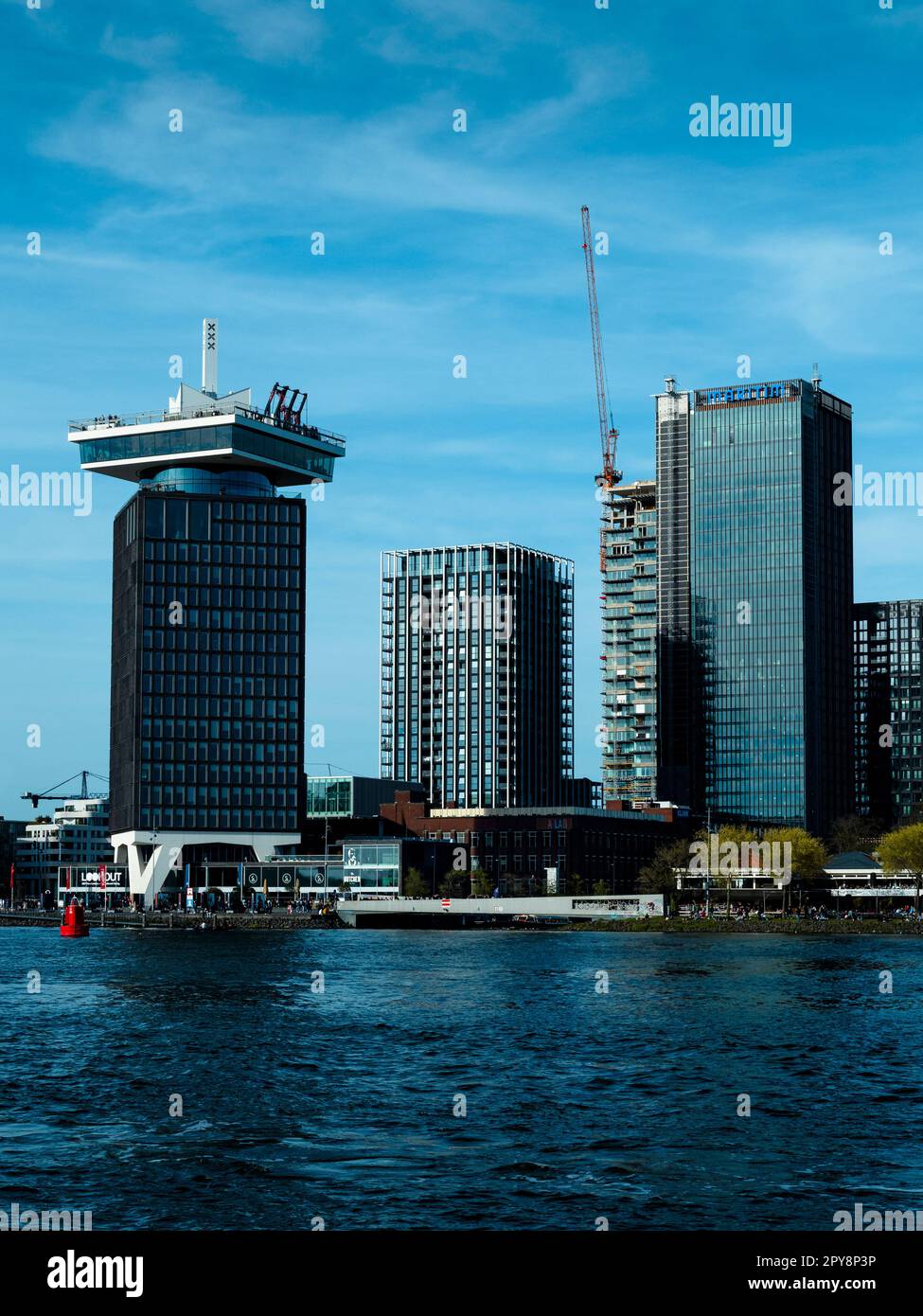 Amsterdam waterfront cityscape by the IJ with the A'DAM Lookout tower ...