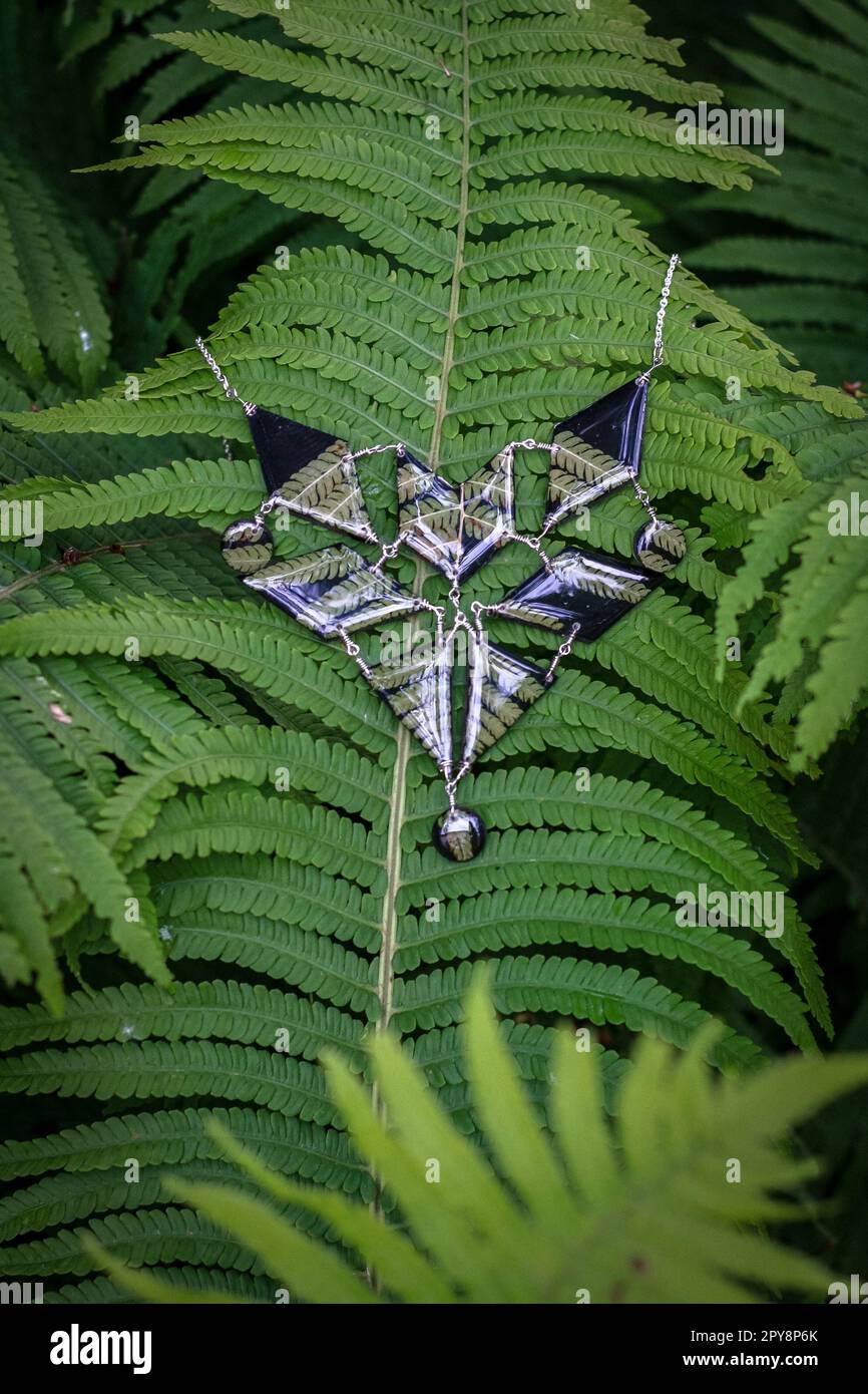 Close up craft necklace with floral pattern concept photo Stock Photo ...