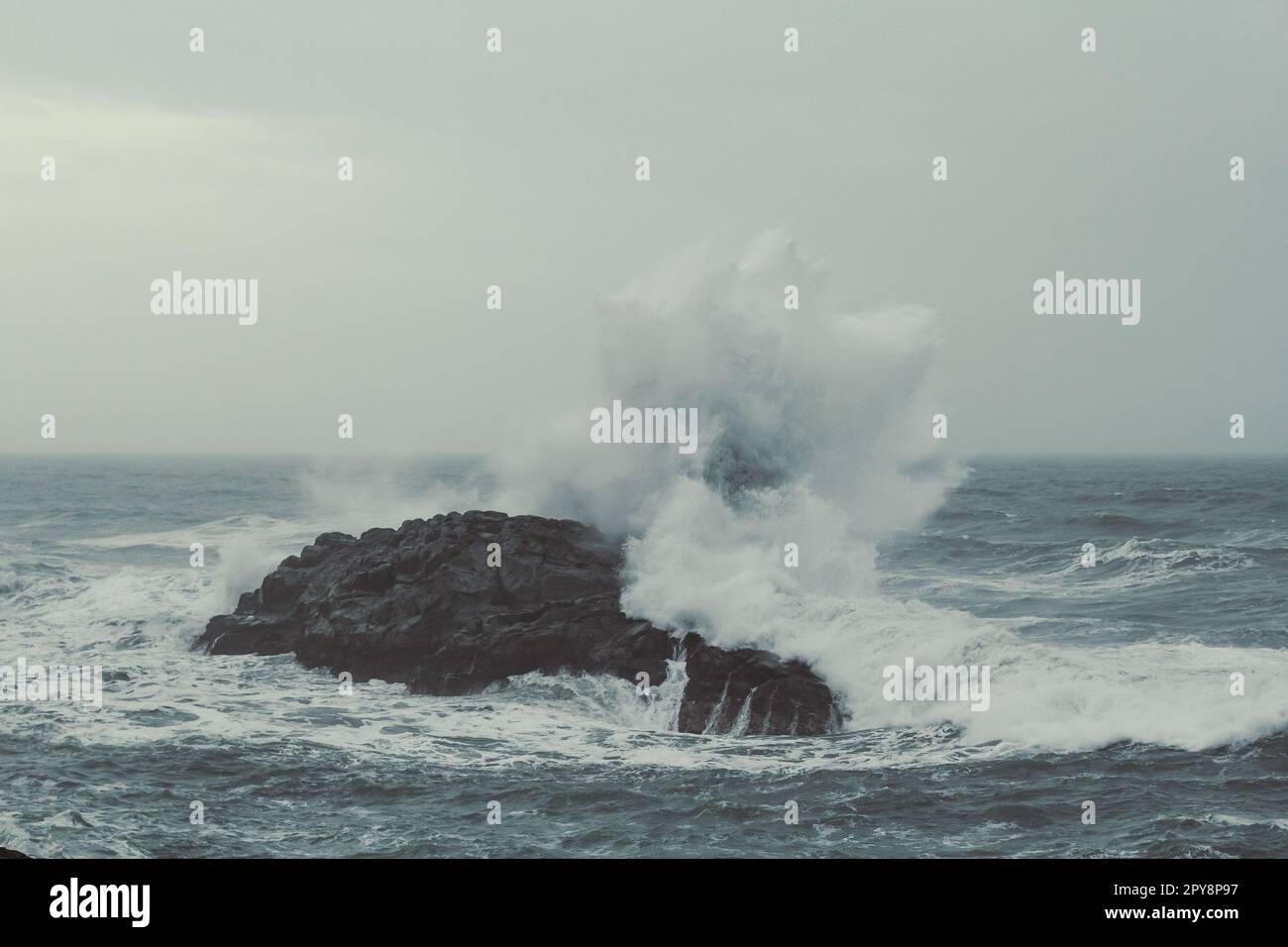 Water splash over cliff in sea landscape photo Stock Photo - Alamy