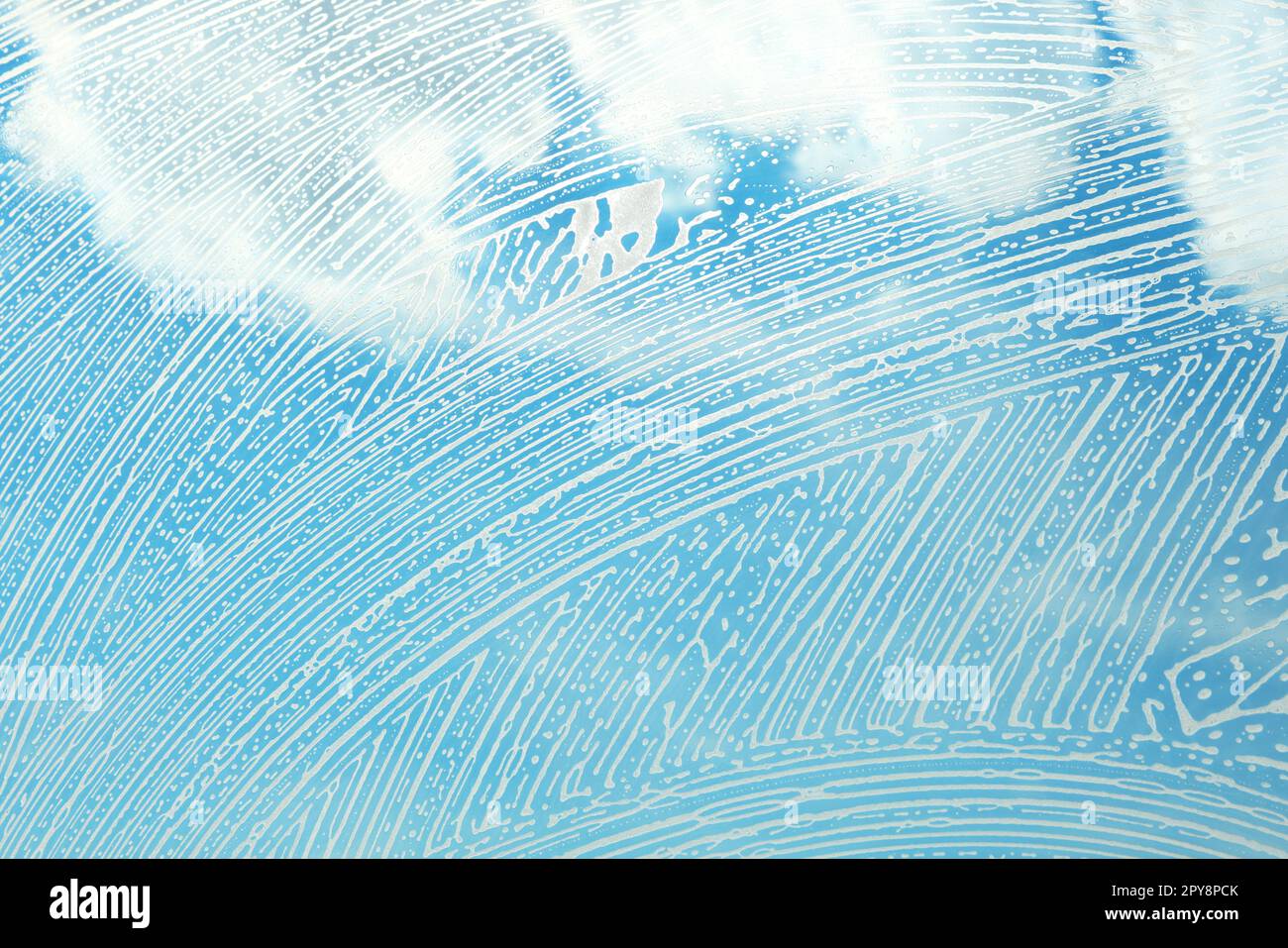 Cleaning foam on window glass, closeup view Stock Photo - Alamy