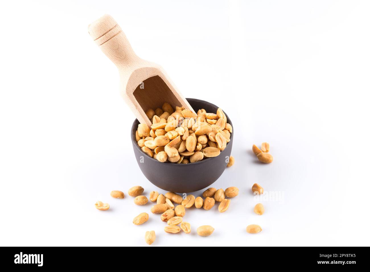 peanut nuts salt in bowl isolated on white background Stock Photo - Alamy