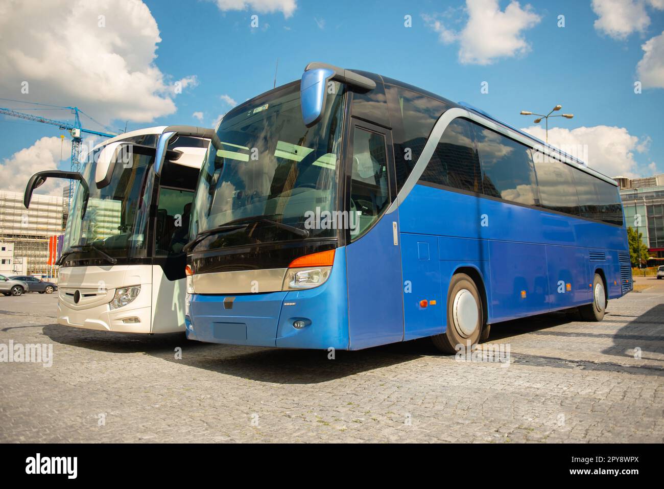 Public transport station with modern buses on sunny day Stock Photo - Alamy