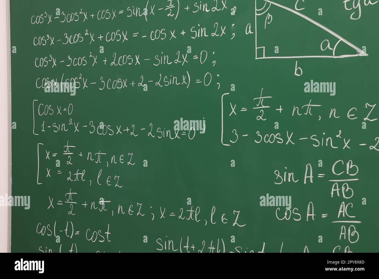 Many different math formulas written on green chalkboard Stock Photo - Alamy