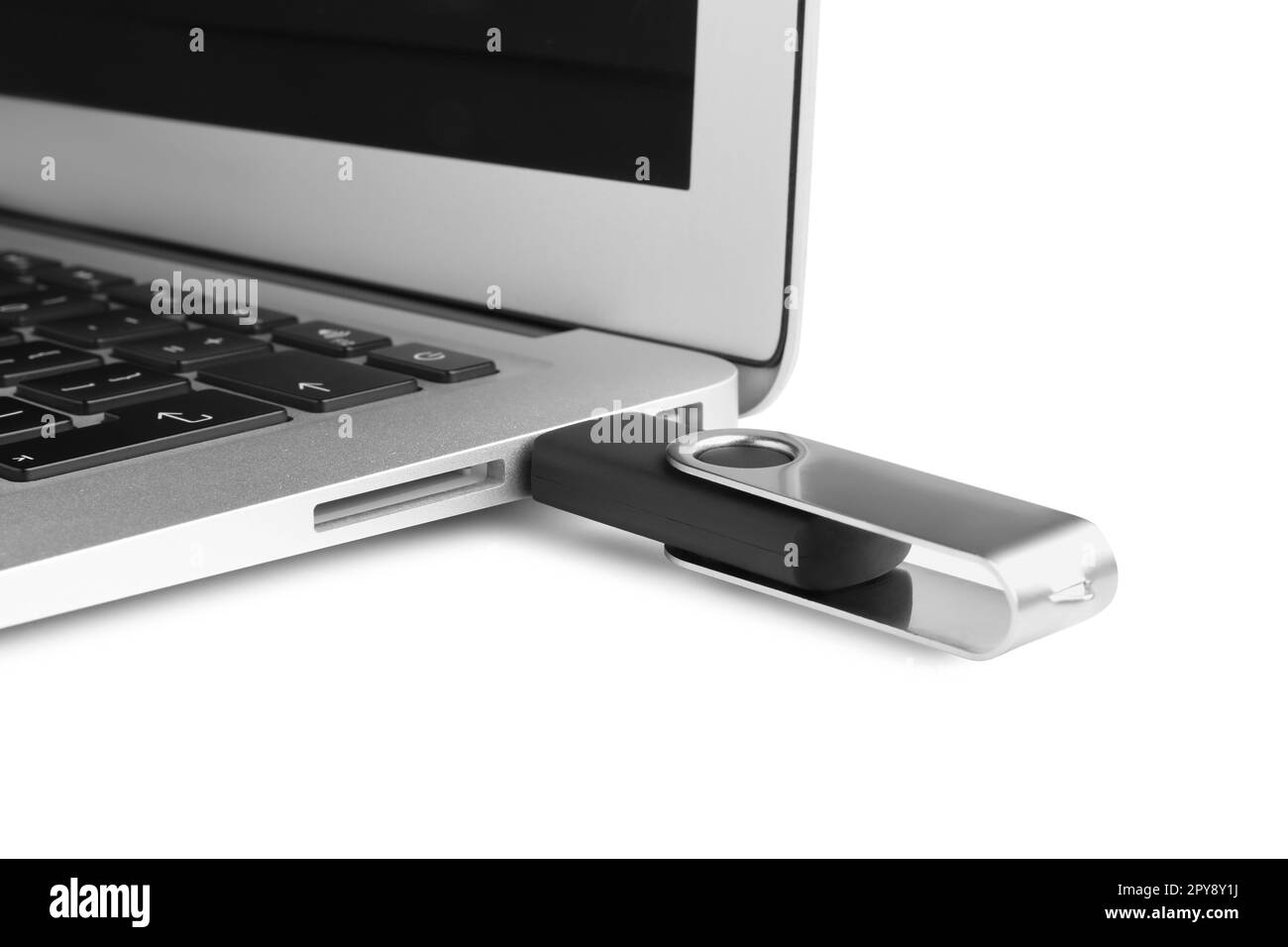Modern usb flash drive attached into laptop on white background ...