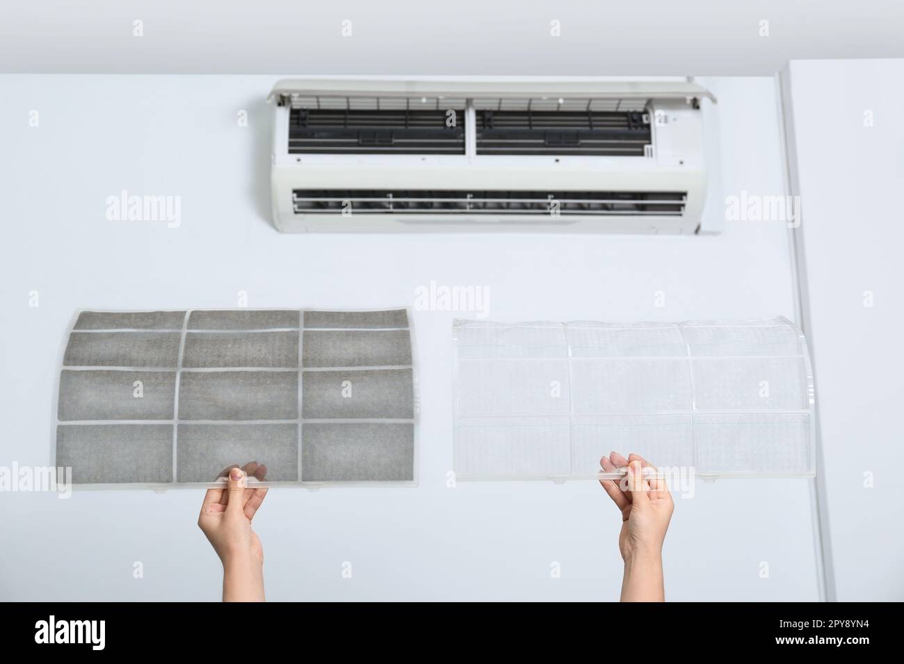 Woman holding dirty and clean filters, closeup. Home air conditioner ...